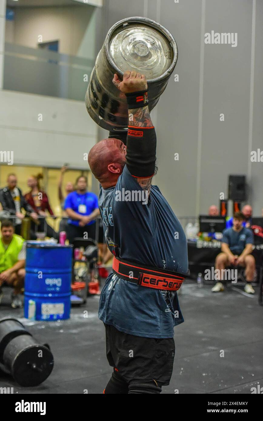 Strongman Matthew Chessum is seen in action with a keg at 2024 Oceania ...