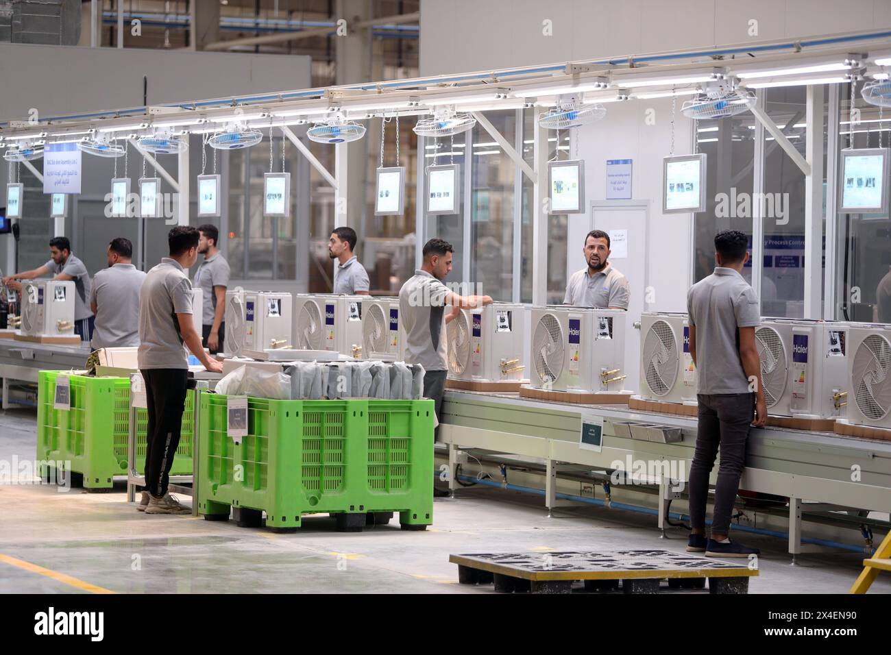 Th Of Ramadan City. 2nd May, 2024. Laborers work on an air-conditioner ...