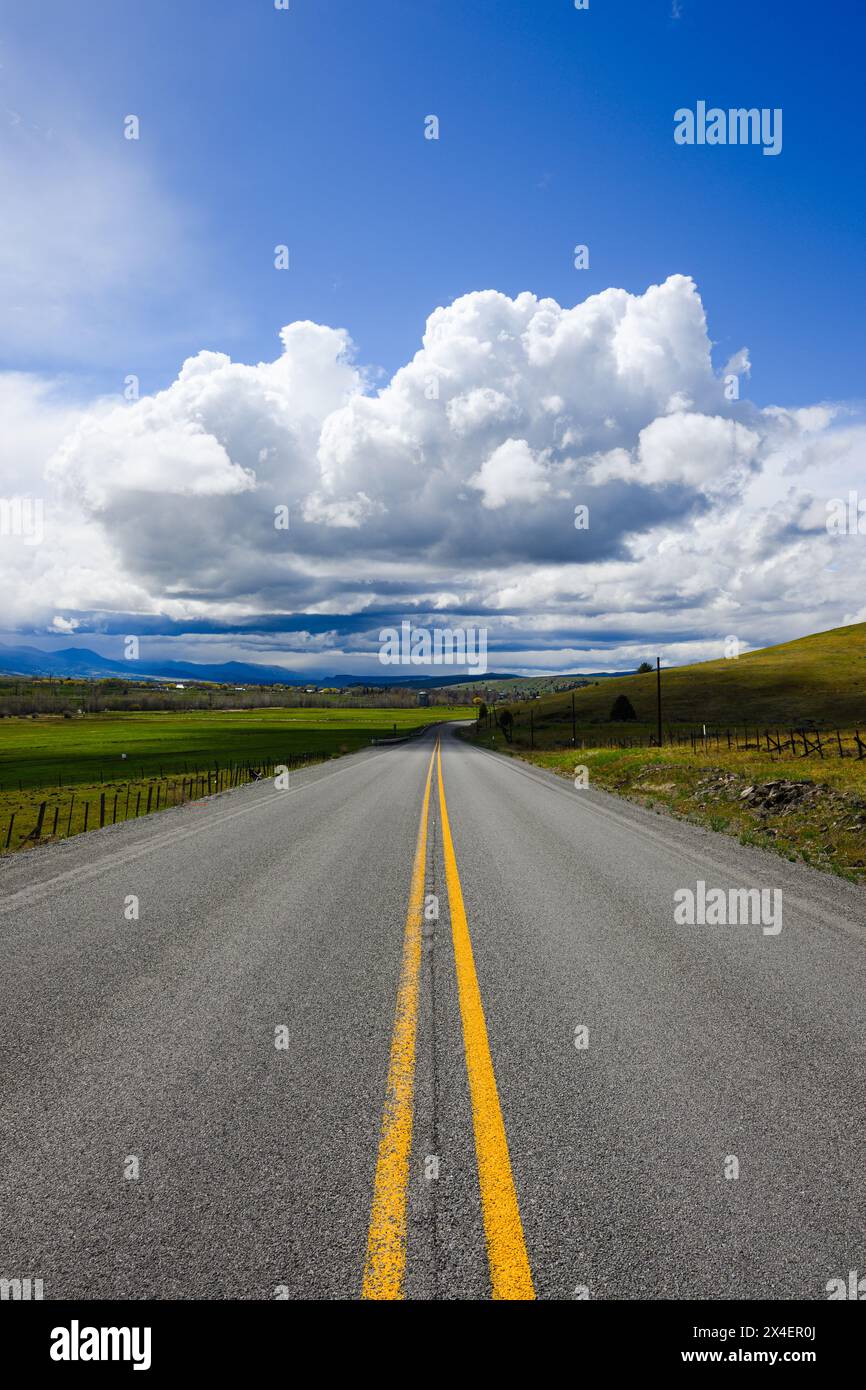 Two lane road in Eastern Oregon with double yellow lines leading to big ...