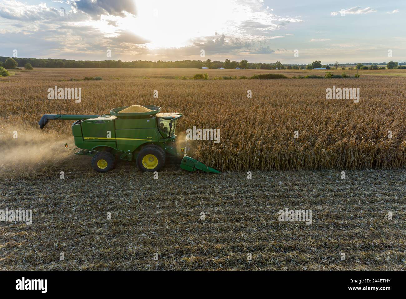 Combine harvesting corn at sunset, Marion County, Illinois. (Editorial ...