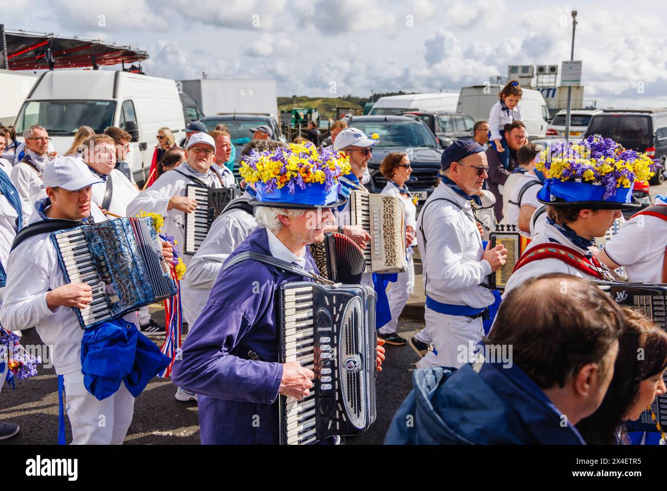 Accordion player with bluebell and cowslip garlanded hat at the 'Obby ...