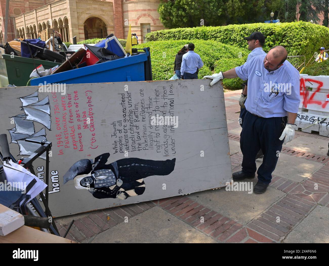 Los Angeles, United States. 02nd May, 2024. Workers clear debris from a ...