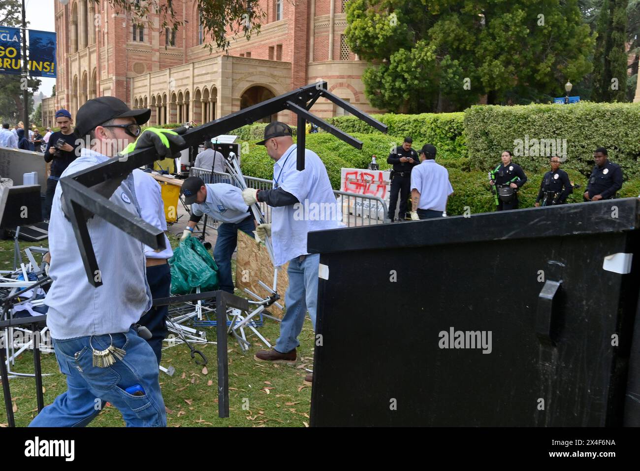 Los Angeles, United States. 02nd May, 2024. Workers clear debris from a ...