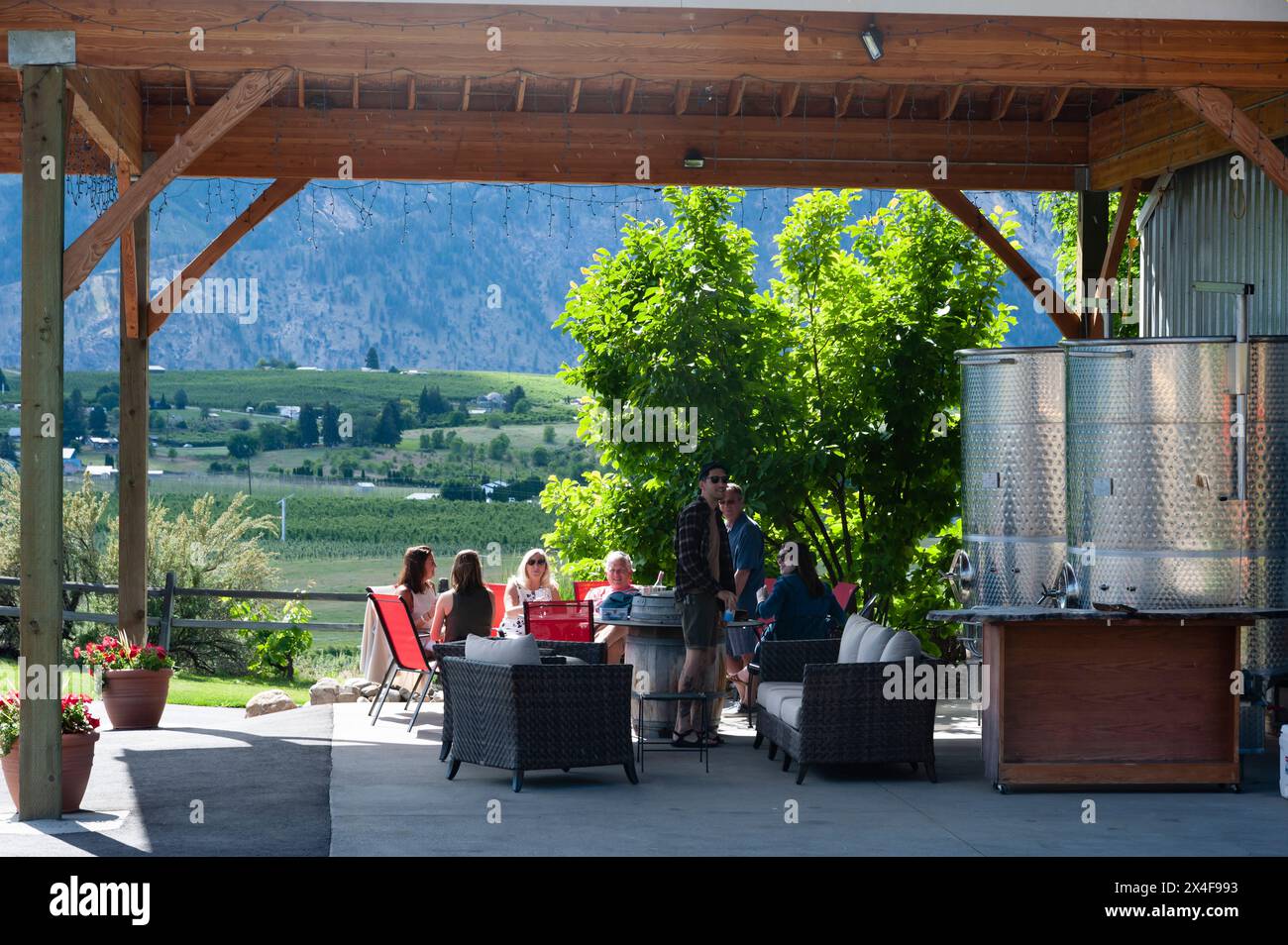 USA, Washington State, Lake Chelan. Wine tasters crowd the grounds of ...