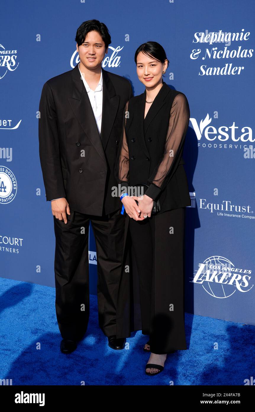 Los Angeles Dodgers pitcher Shohei Ohtani, left, and his wife Mamiko ...