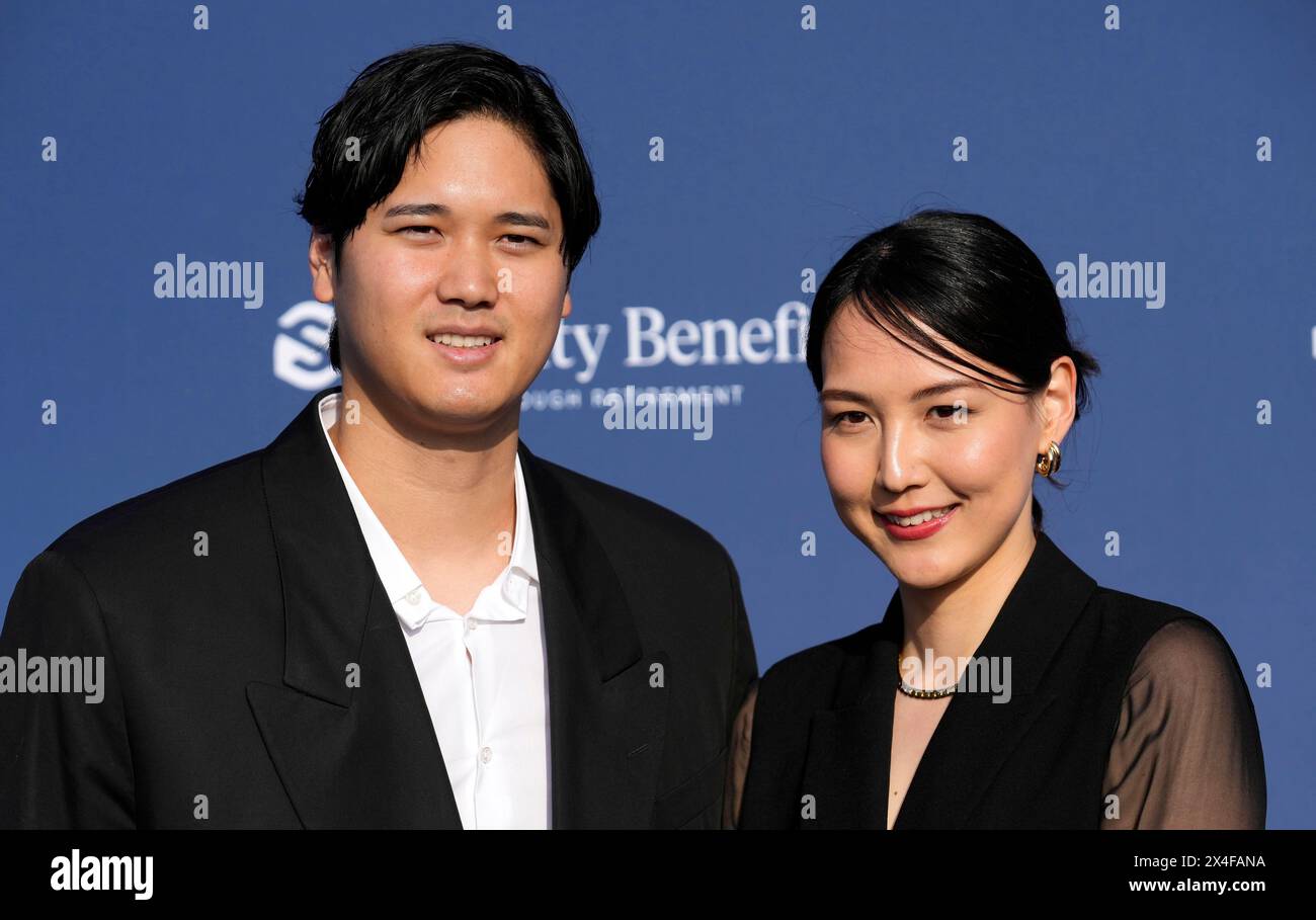 Los Angeles Dodgers pitcher Shohei Ohtani, left, and his wife Mamiko ...
