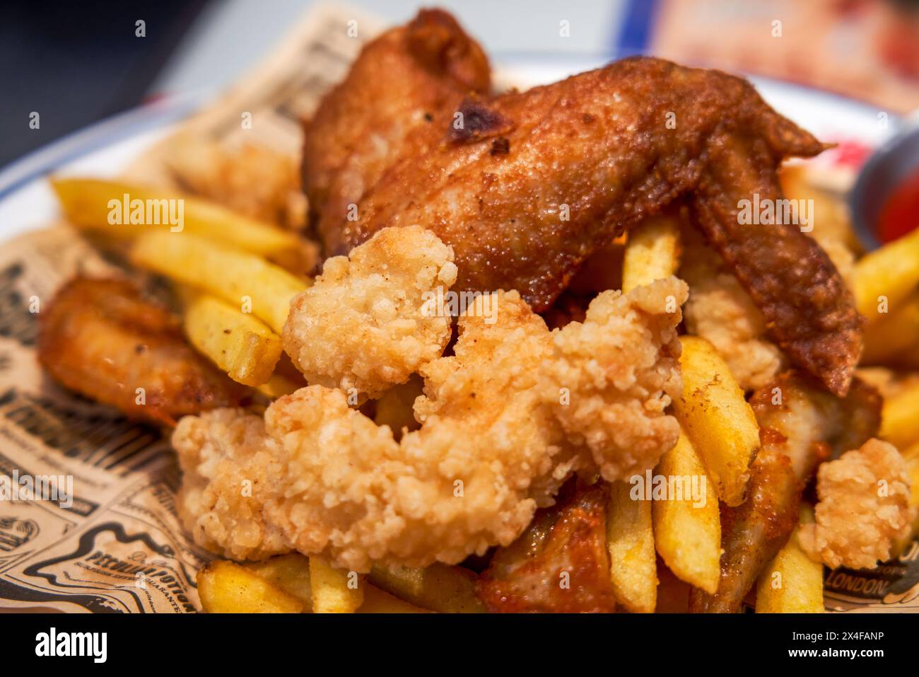 Fried food platter in Hong Kong tea restaurant, fried chicken wings and ...