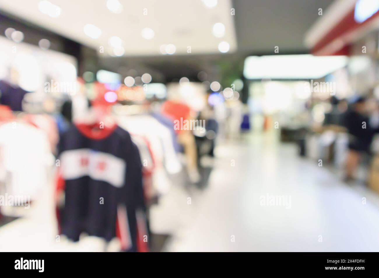 Abstract blur clothing boutique display interior of shopping mall ...