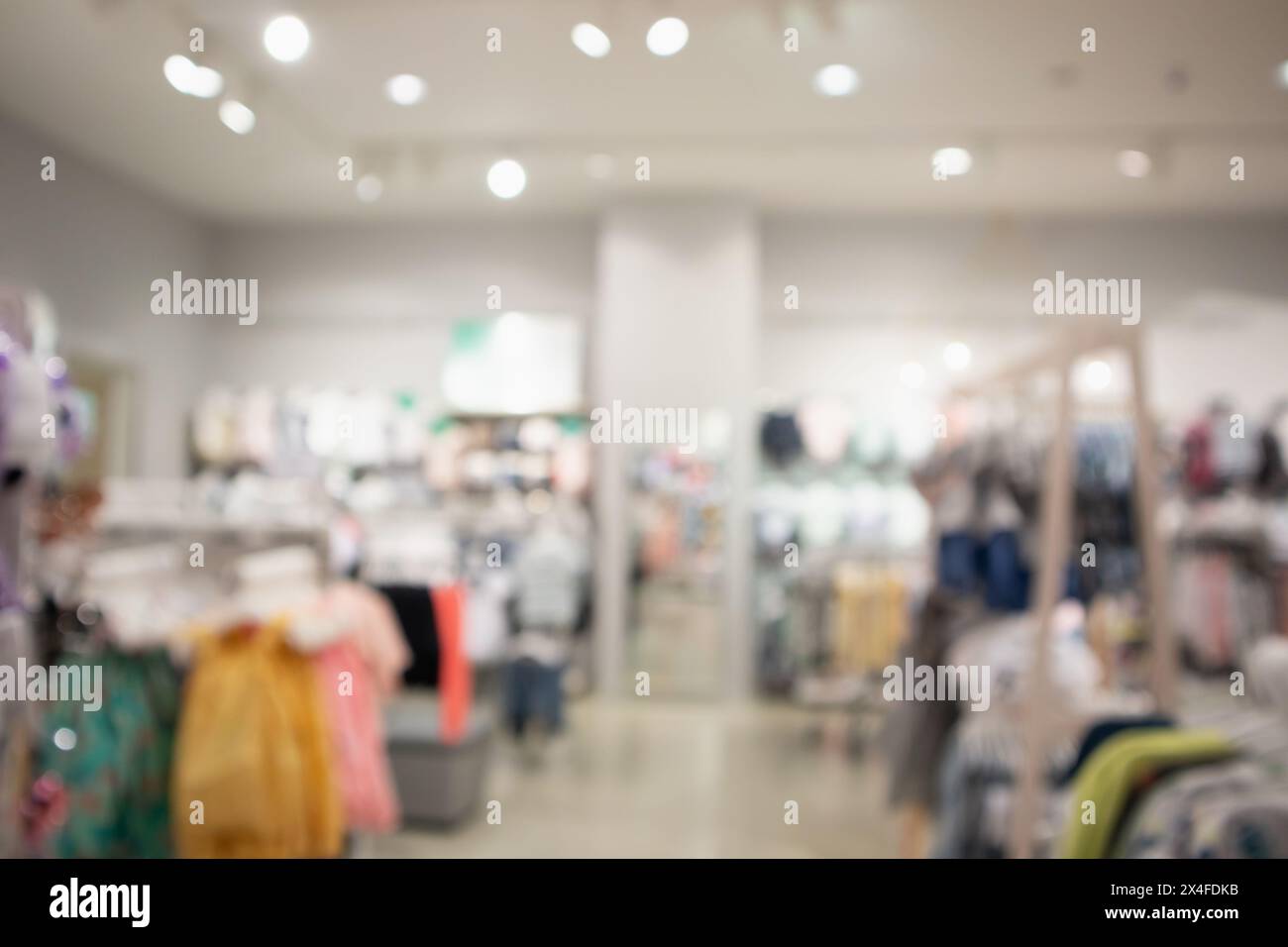 clothing store interior abstract blur background Stock Photo - Alamy