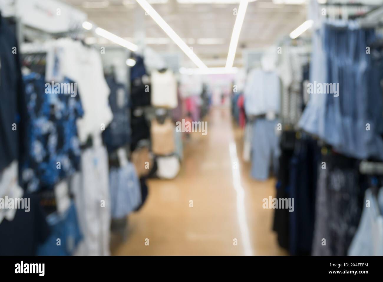 Abstract blurred fashion clothing store in modern shopping mall ...
