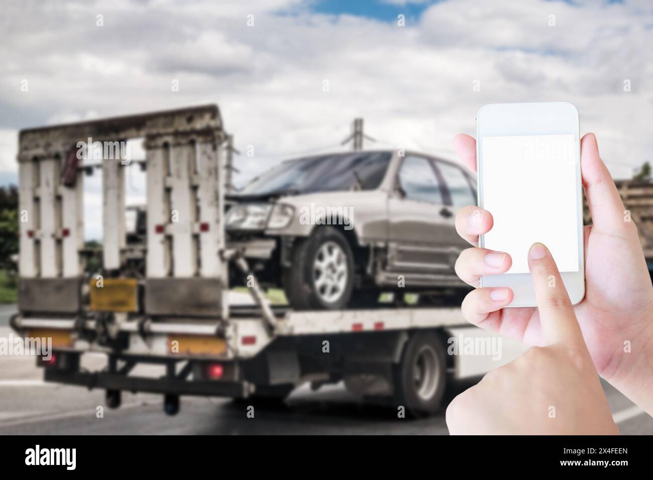 Hand using mobile smartphone for emergency roadside service with Broken ...