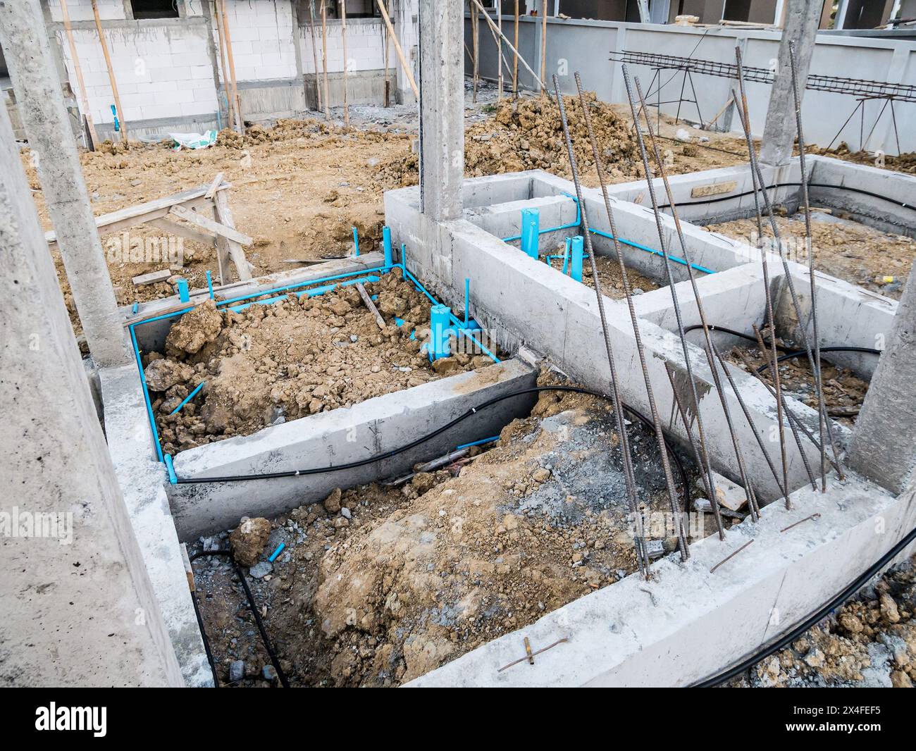 Pest control pipe system install at new house construction foundation ...