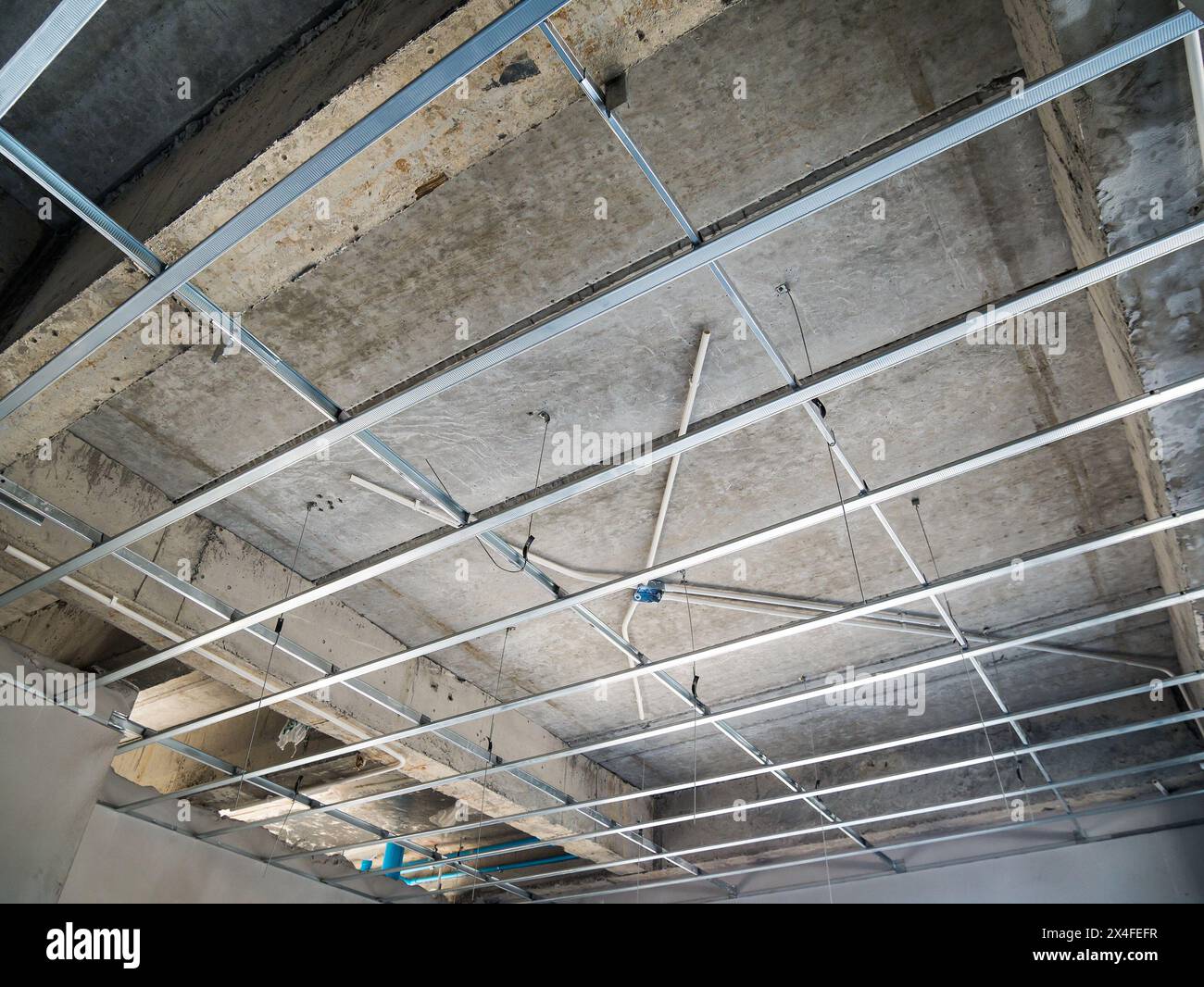 Install metal frame for plaster board ceiling at house under ...