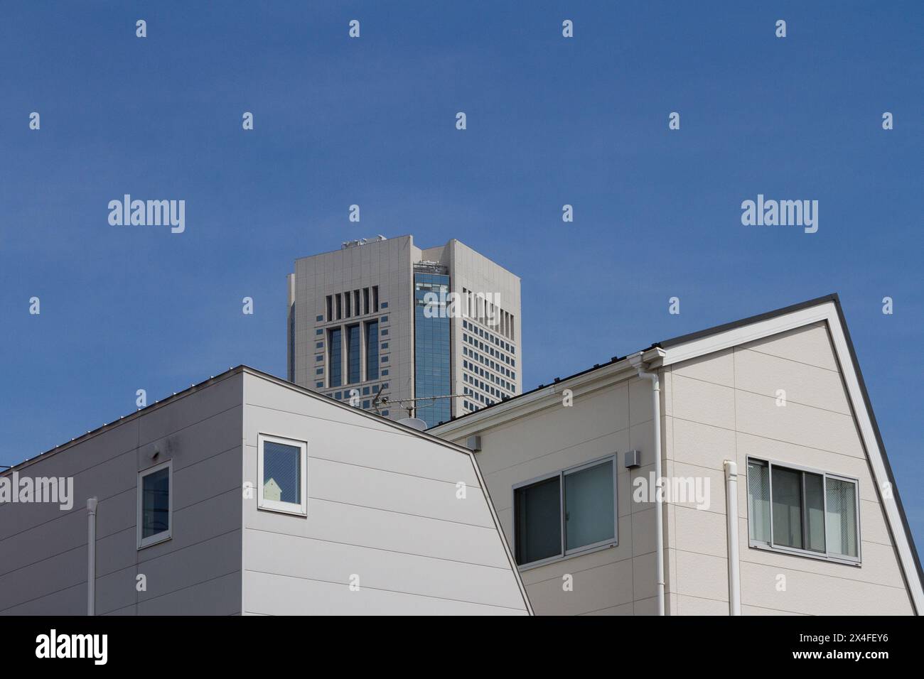 Tokyo Opera City Tower seen behind houses in Shinjuku, Tokyo, Japan ...