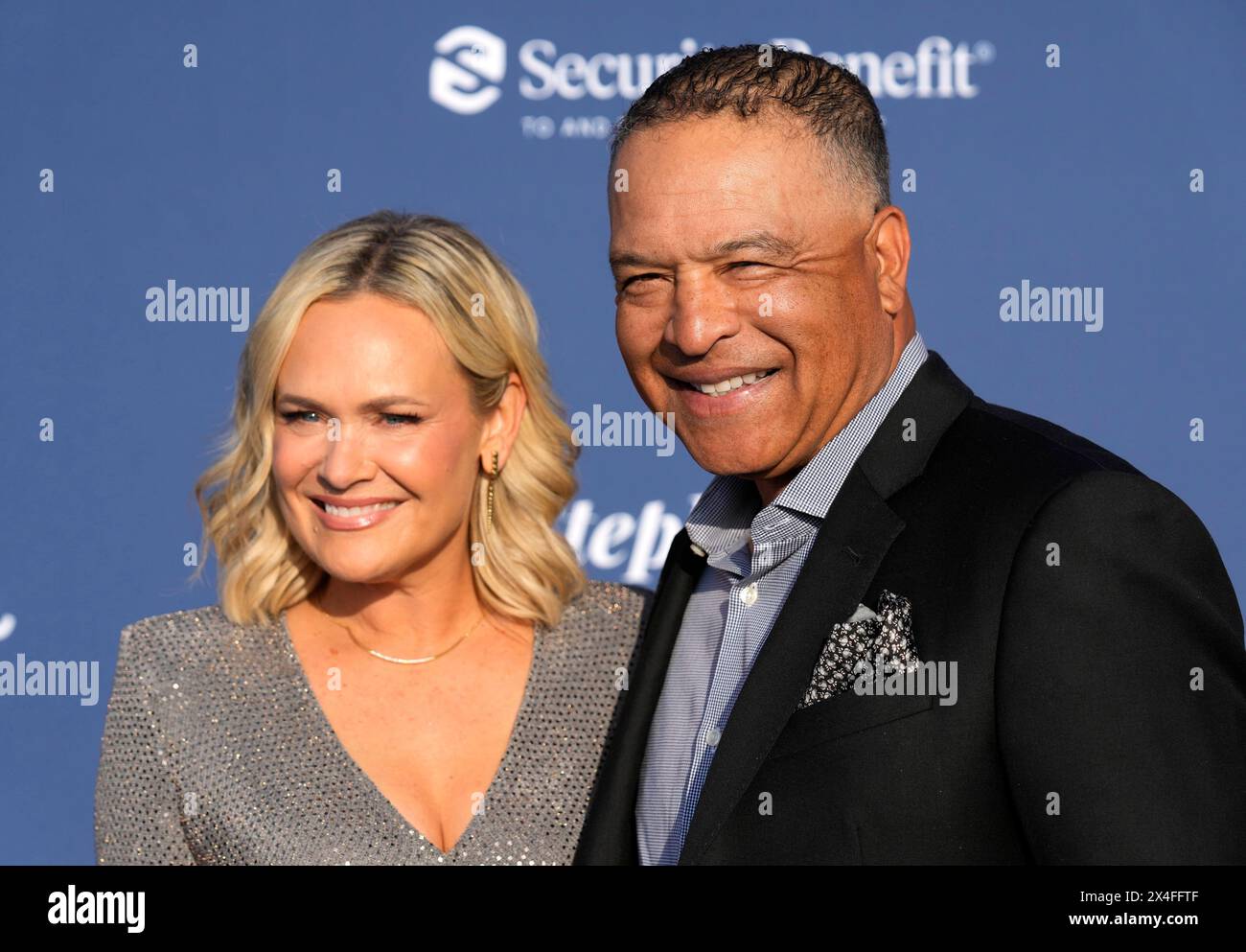 Los Angeles Dodgers manager Dave Roberts and his wife Tricia pose ...