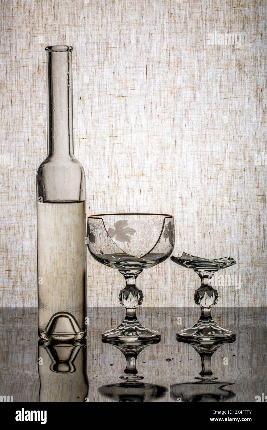 Still life with glassware and a broken glass Stock Photo - Alamy