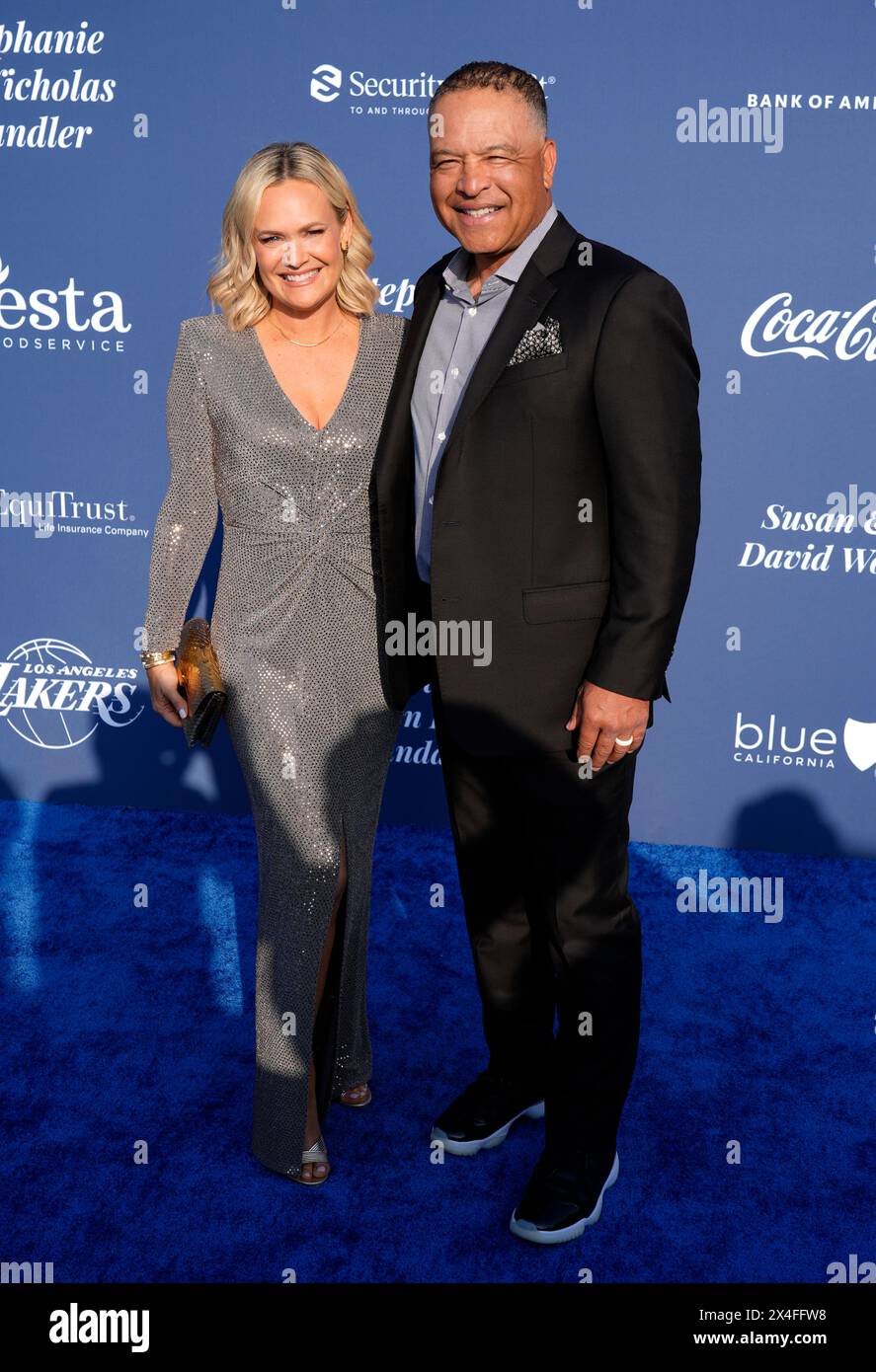 Los Angeles Dodgers manager Dave Roberts and his wife Tricia pose ...