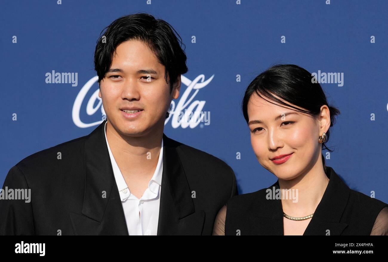 Los Angeles Dodgers' Shohei Ohtani and his wife Mamiko Tanaka pose ...