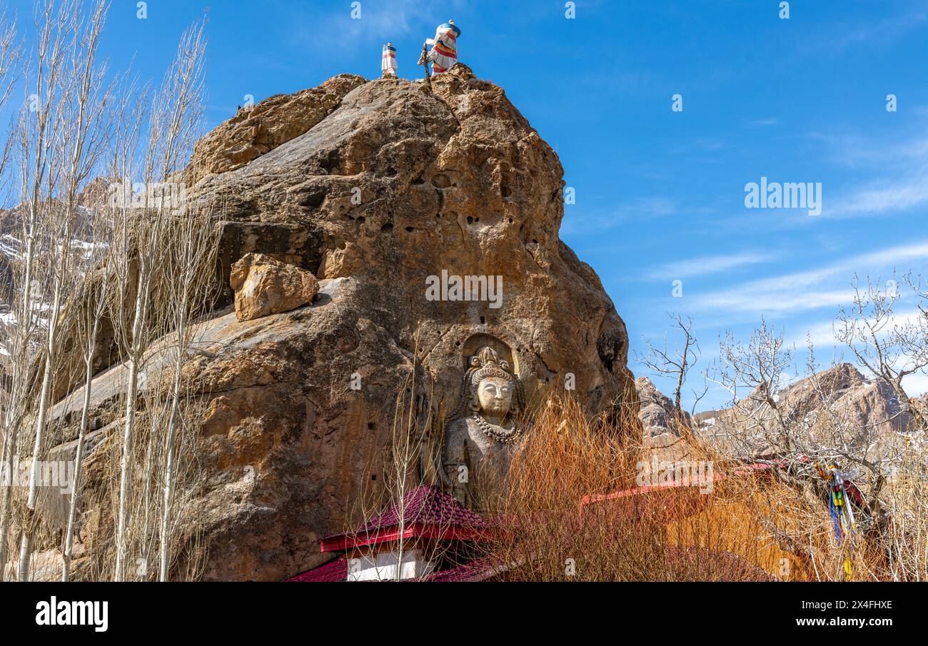 Large Buddha carved in stone in a hill at the Mulbekh Buddhist ...