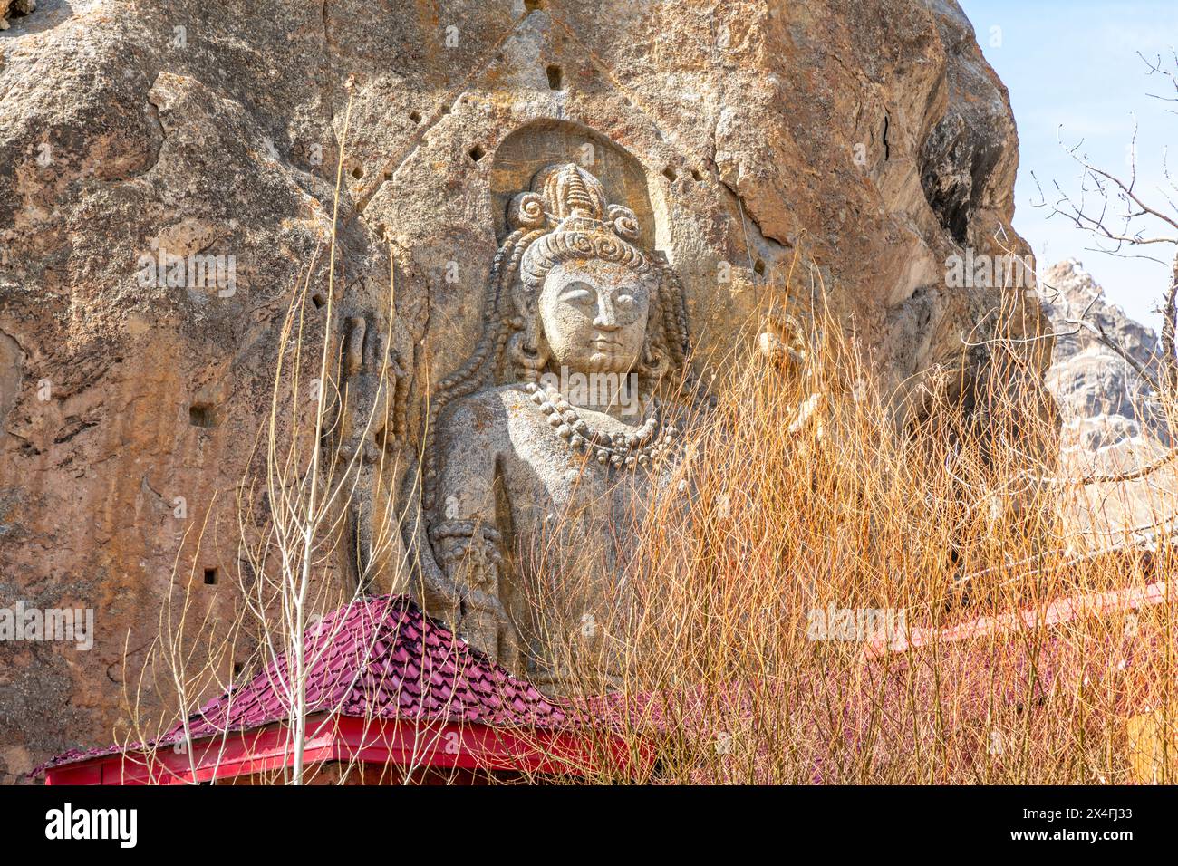 Large Buddha carved in stone in a hill at the Mulbekh Buddhist ...