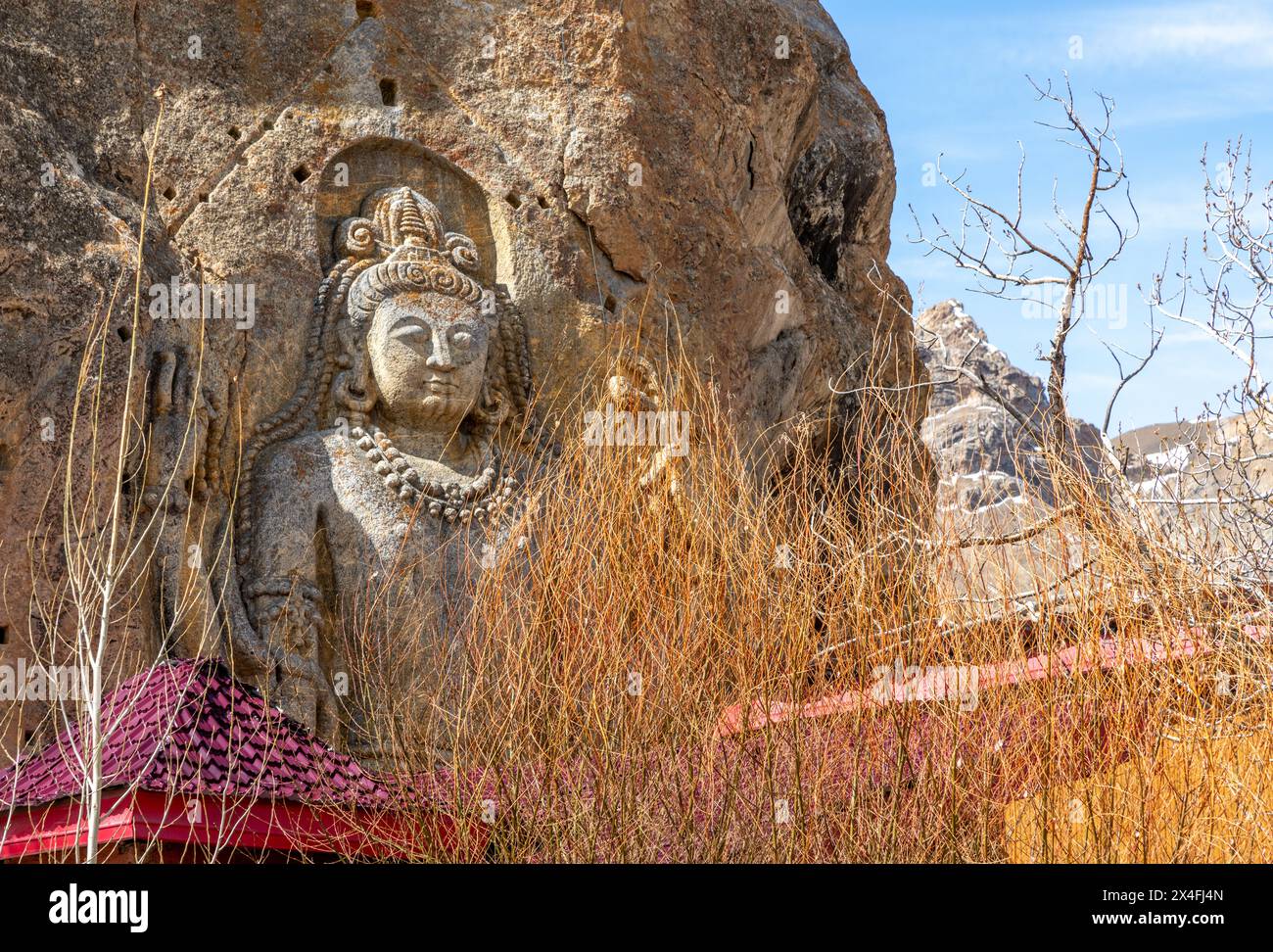Large Buddha carved in stone in a hill at the Mulbekh Buddhist ...