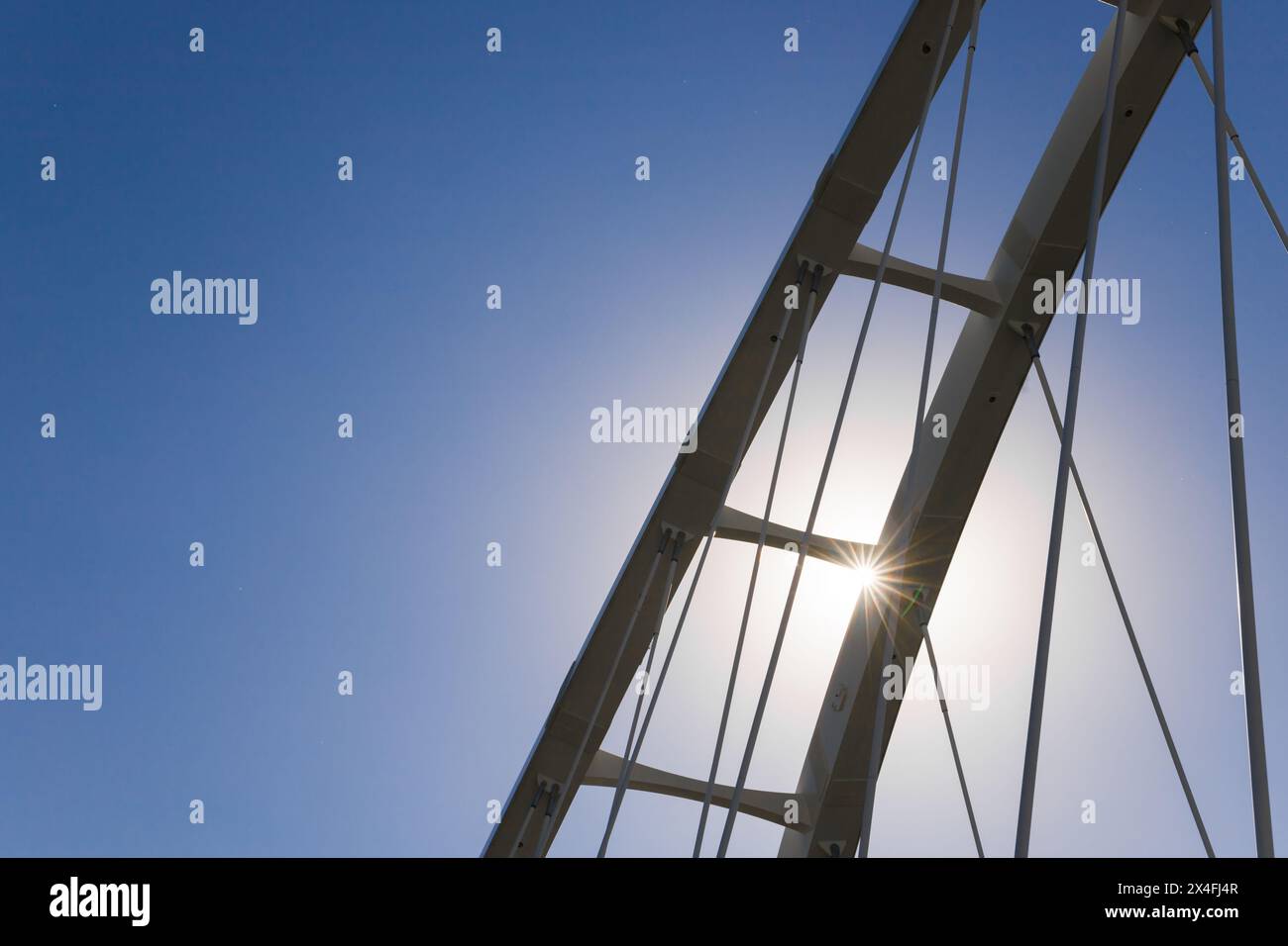 White bridge detail - sun rays trough the bridge. Modern architecture ...