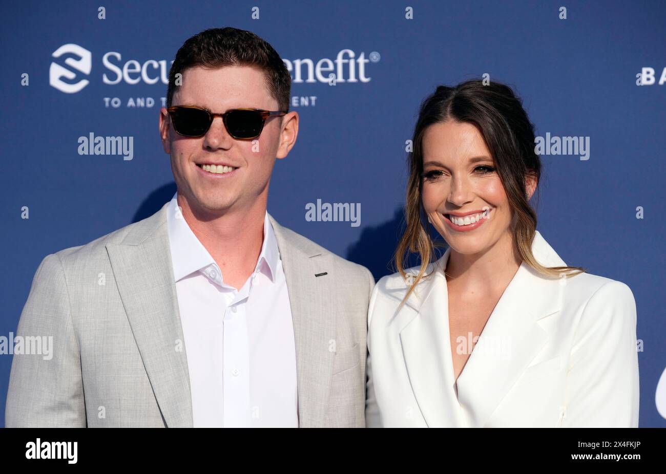 Los Angeles Dodgers' Will Smith and his wife Cara pose together at the ...