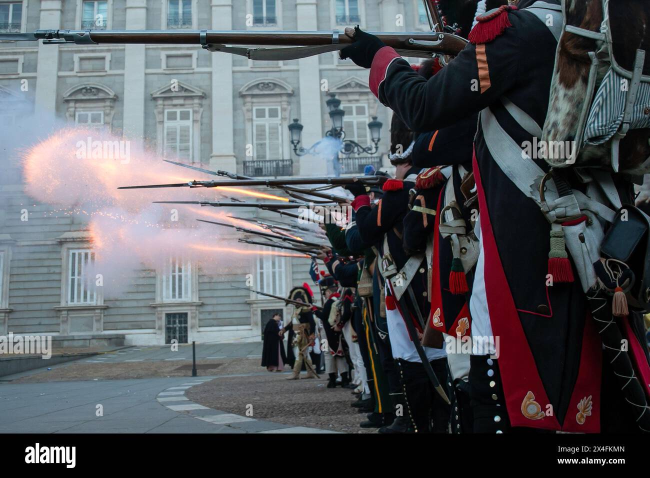 A group of extras recreate a battle during an artistic performance in ...