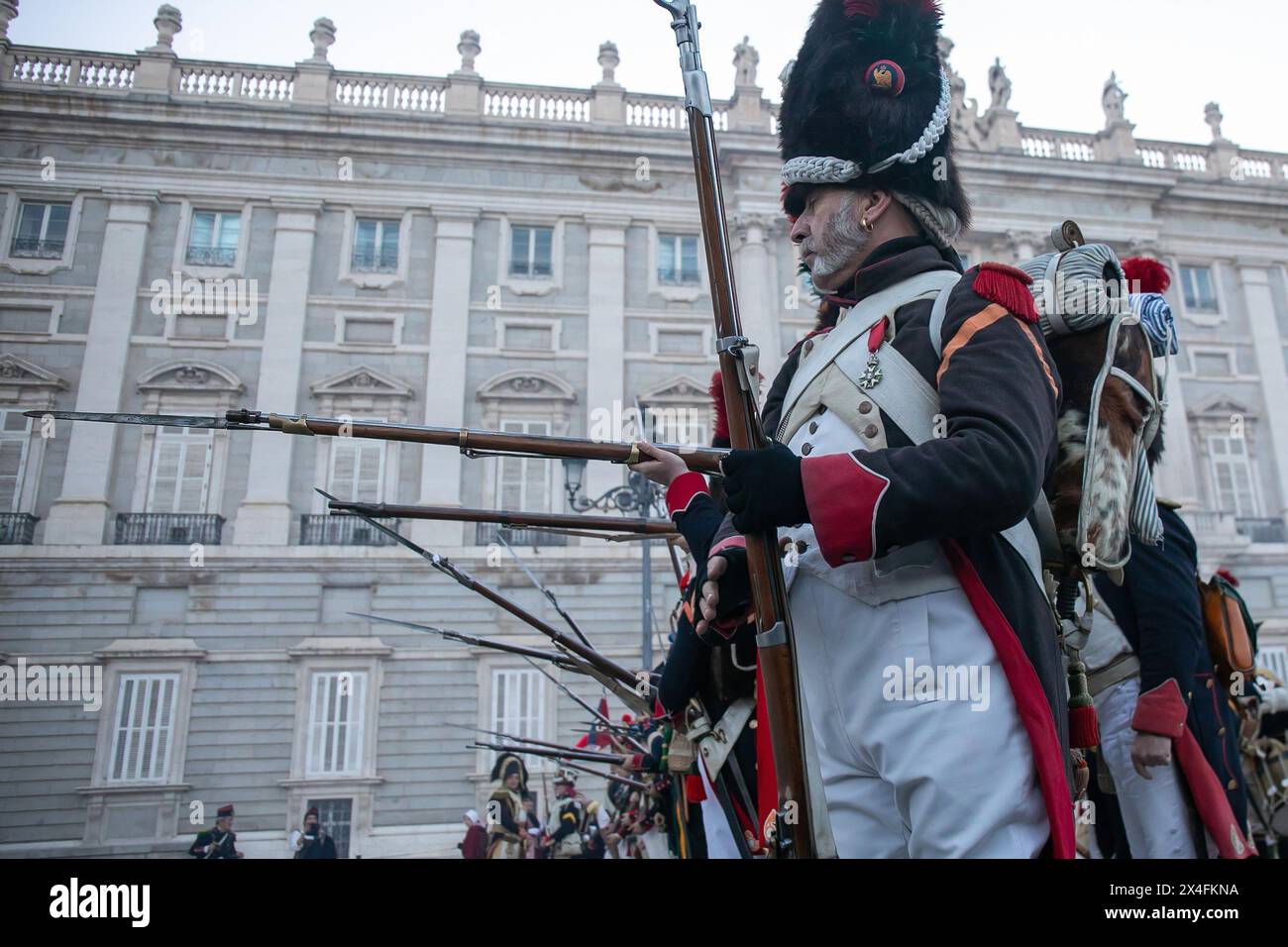 A group of extras recreate an artistic representation in the center of ...