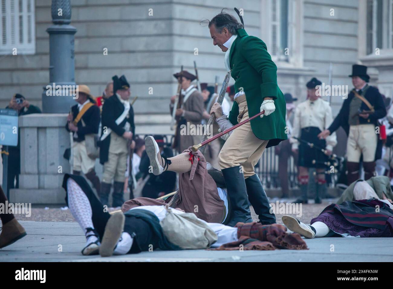 A group of extras recreate a battle during an artistic performance in ...
