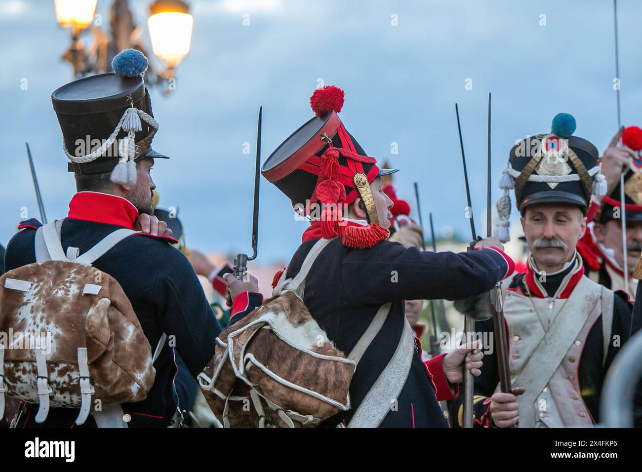 A group of extras recreate an artistic representation in the center of ...