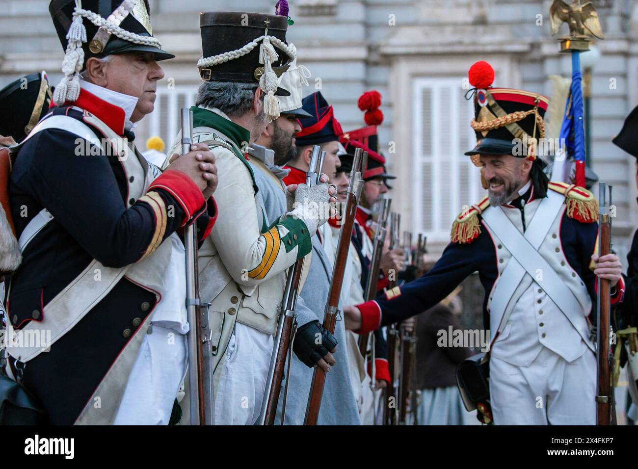 A group of extras recreate an artistic representation in the center of ...