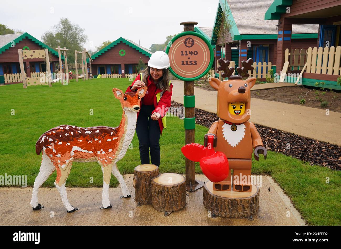 LEGOLAND Windsor Resort team member Jennifer Howlett adds pieces to a ...