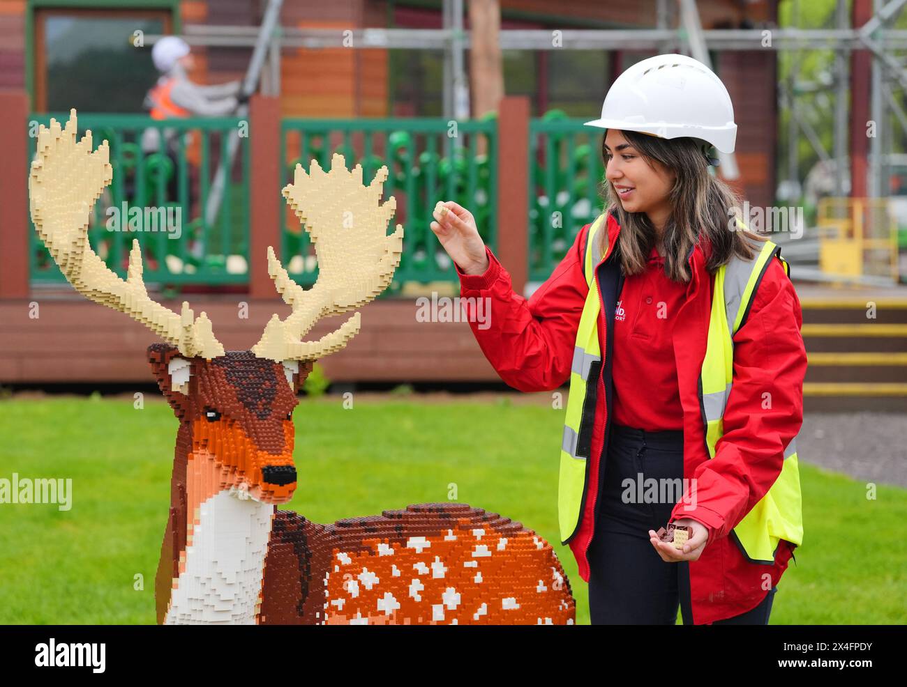 LEGOLAND Windsor Resort team member Jennifer Howlett adds pieces to a ...