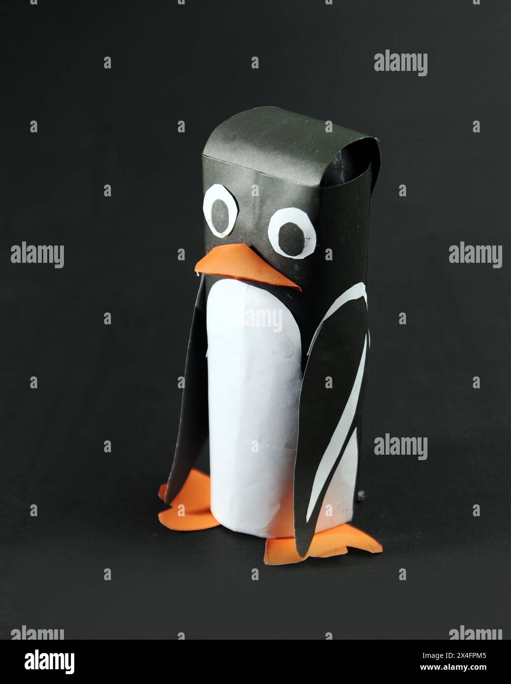 A penguin paper cruft. made of color paper attached with glue for ...