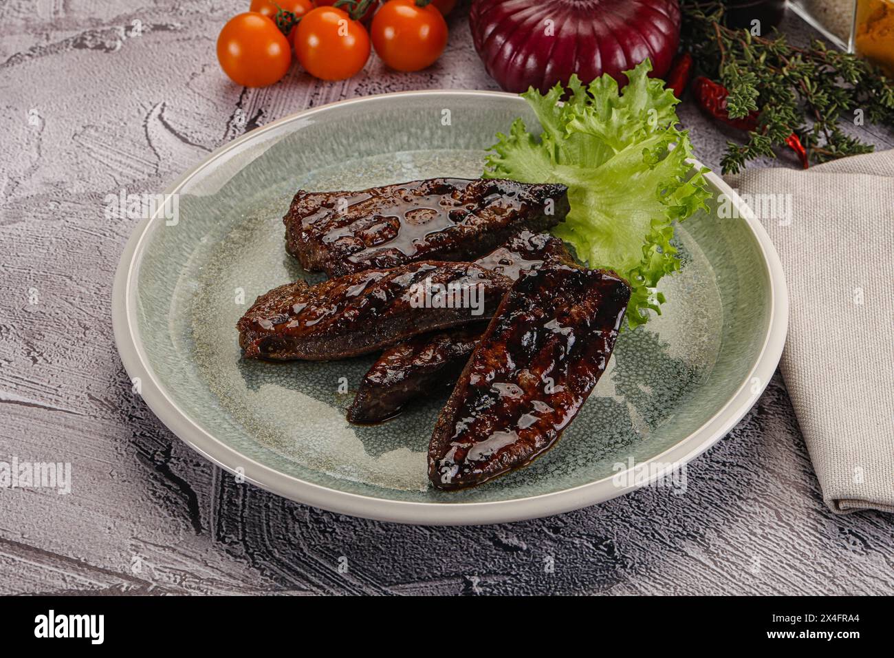 Grilled diet beef liver steak in the plate Stock Photo - Alamy