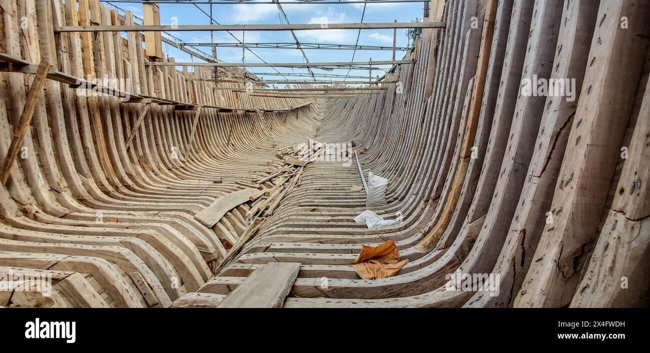 Interior of a giant traditional dhow in the shipbuilding factory of Sur ...