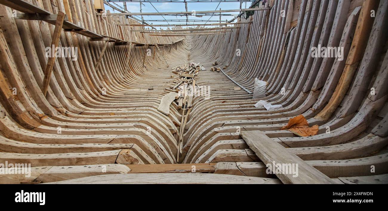 Interior of a giant traditional dhow in the shipbuilding factory of Sur ...