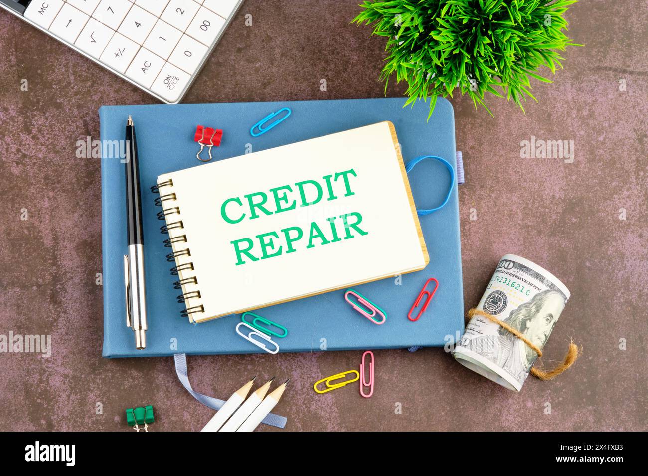 CREDIT REPAIR text written on a blank sheet of a notebook. View from ...