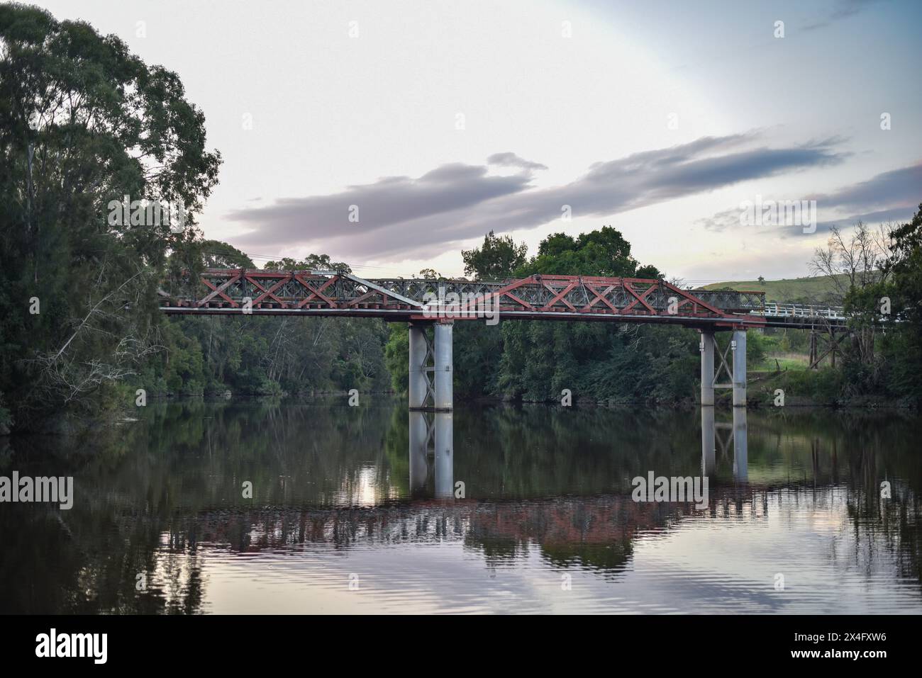 red bridge reflecting in still water Stock Photo - Alamy