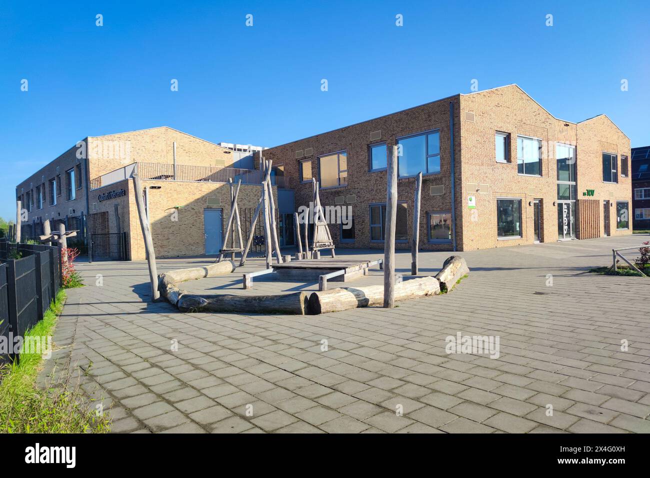 Wooden children's playground in the schoolyard for an elementary school ...