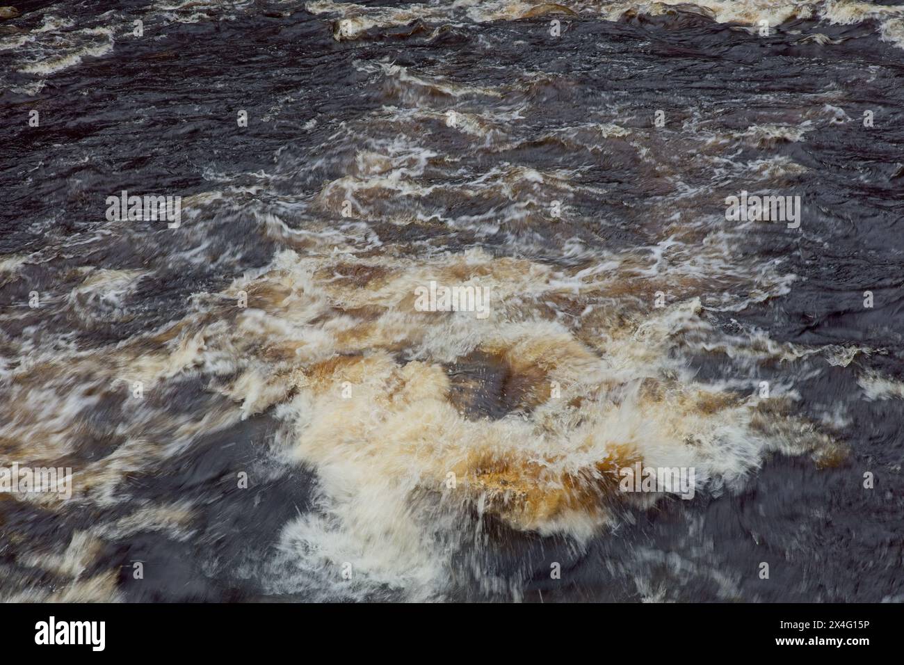 Rough river water flowing with bubbles and foam Stock Photo - Alamy