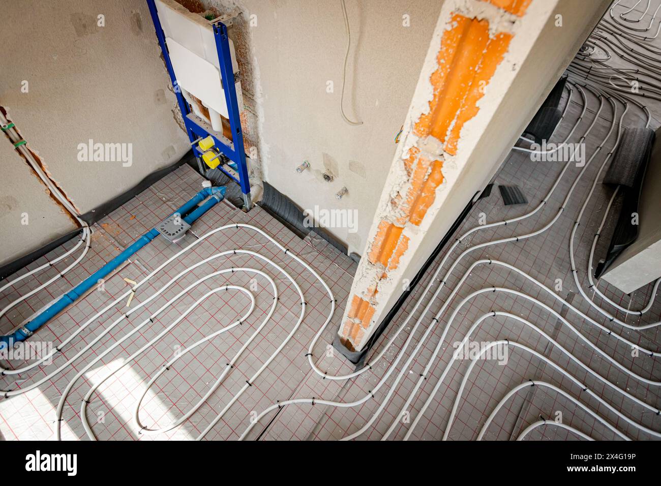 Thin white tubes are bended in complex curve of new brass, distribution ...