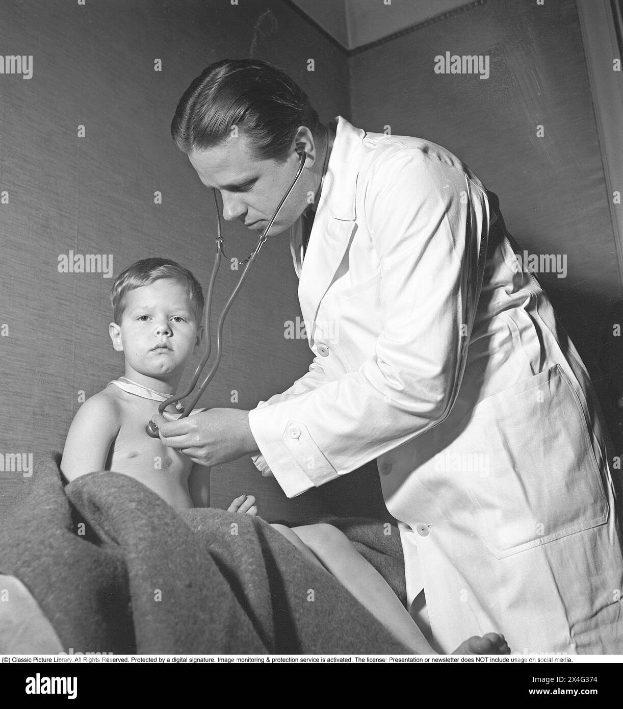 World War 2 in Europe. Finnish children in Sweden. A doctor examines a ...