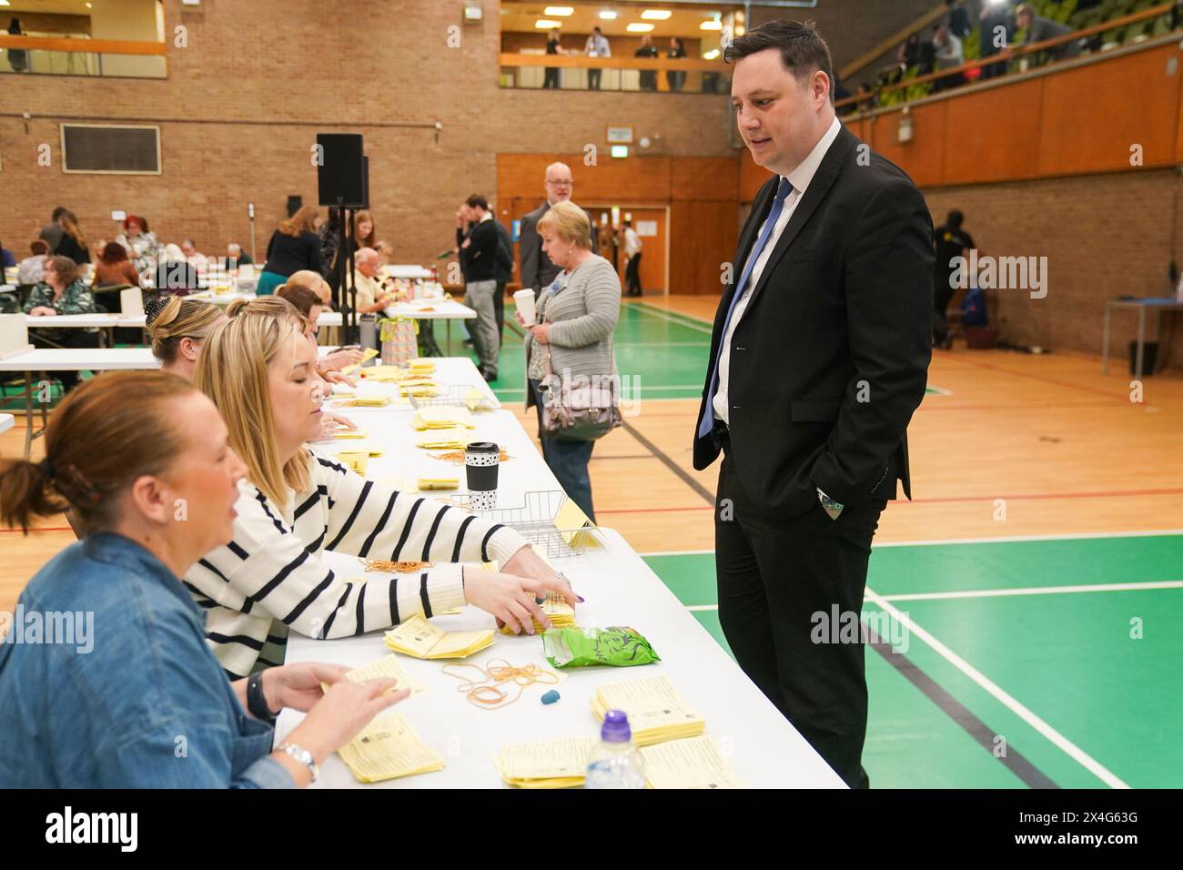 Conservative party candidate Lord Ben Houchen observes a count of votes ...