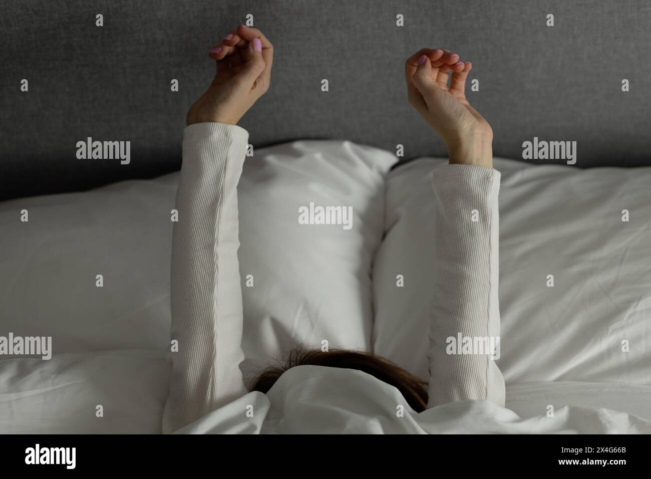 Outstretched human hands from under the blanket Stock Photo - Alamy