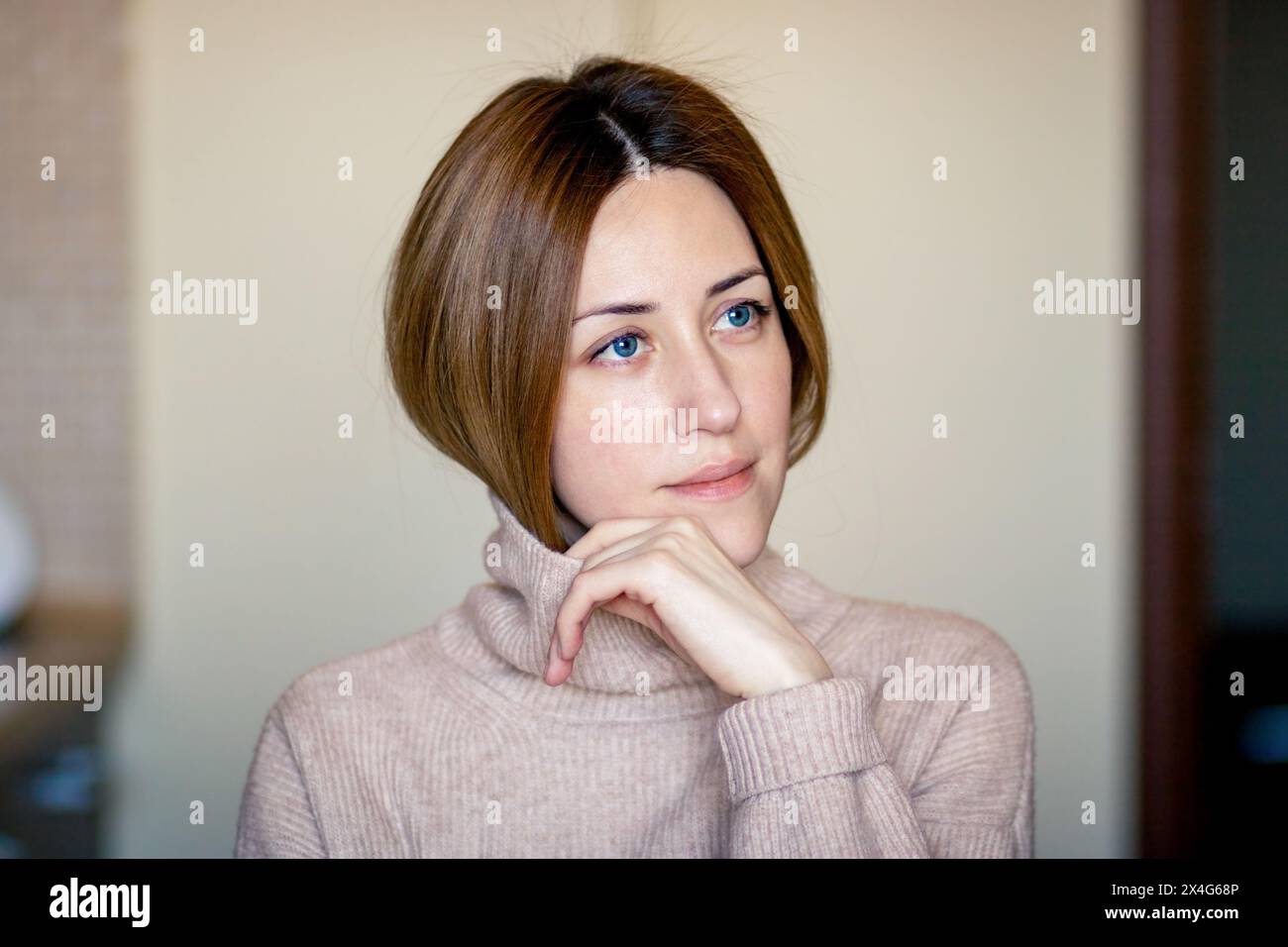 Portrait of woman in soft sweater at home Stock Photo - Alamy