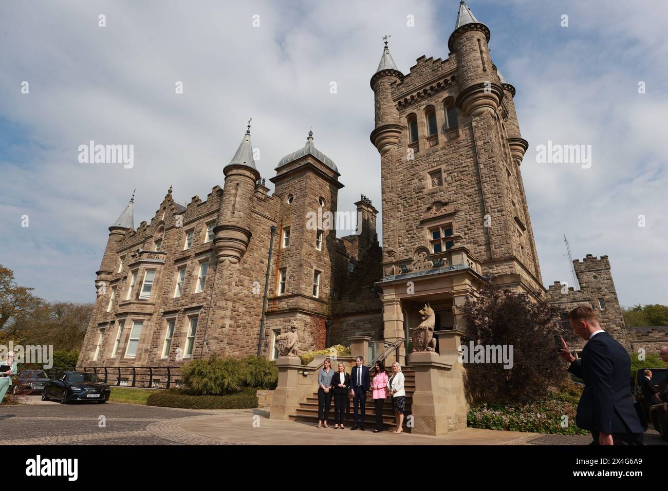 Taoiseach Simon Harris being greeted on the steps of Stormont Castle by ...