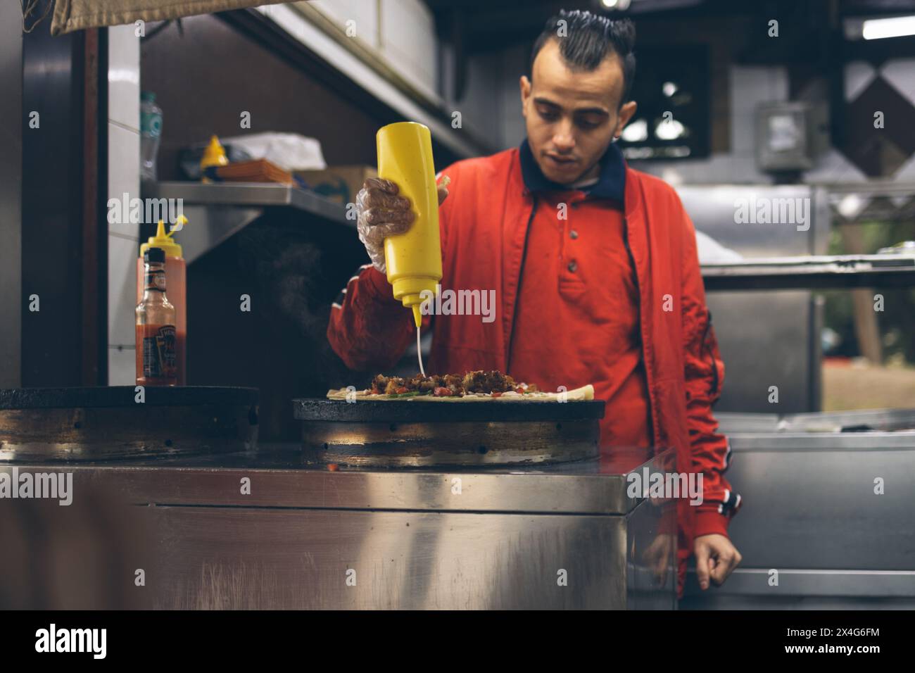 Person preparing traditional street food Stock Photo - Alamy