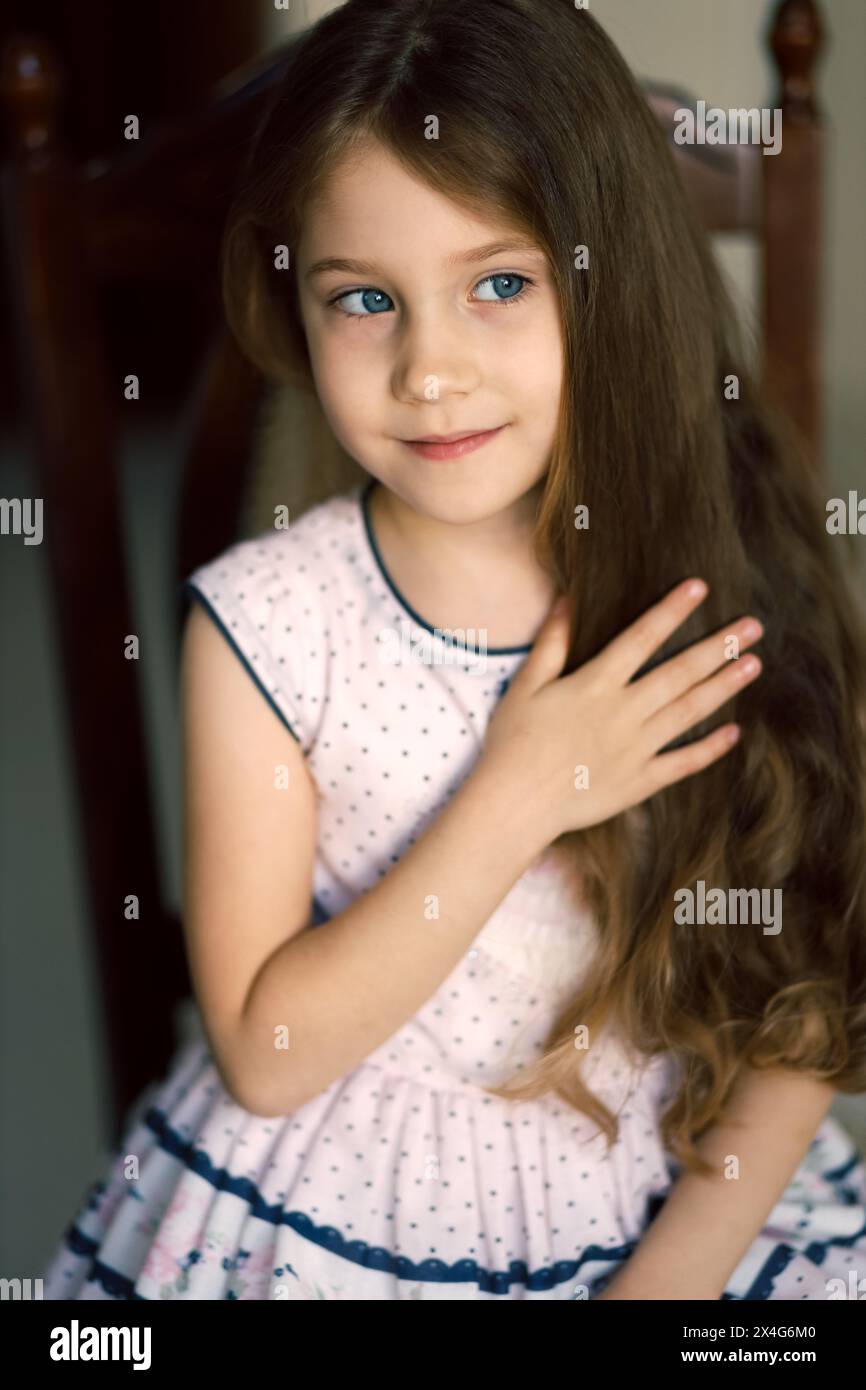 Portrait of little child with long hair Stock Photo - Alamy
